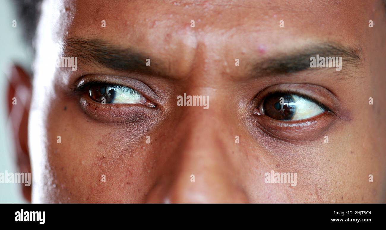 African man close-up macro eyes thinking pondering solution Stock Photo ...