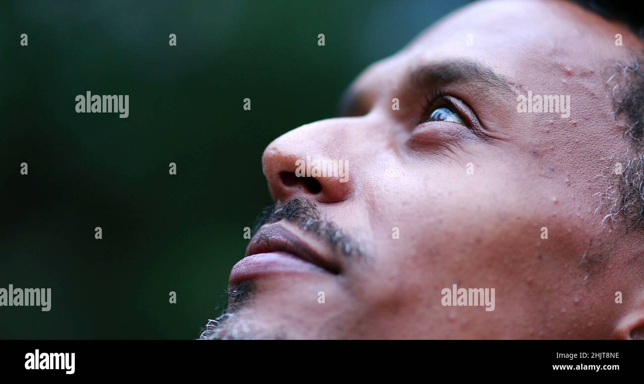 Black man face looking at the sky, african mixed race profile feeling ...