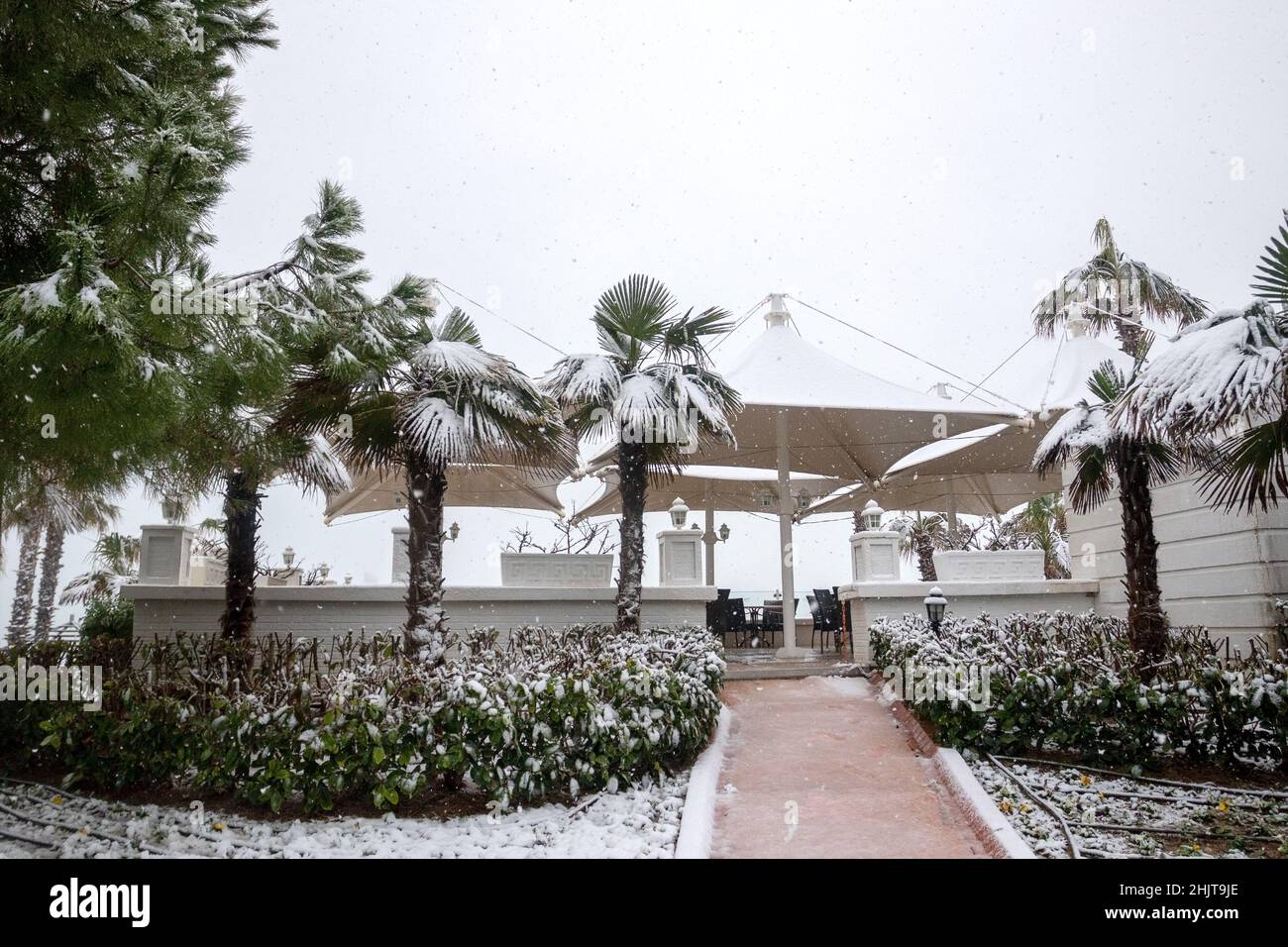 Heavy snowfall on the Mediterranean coast. Snow storm and white covered ...