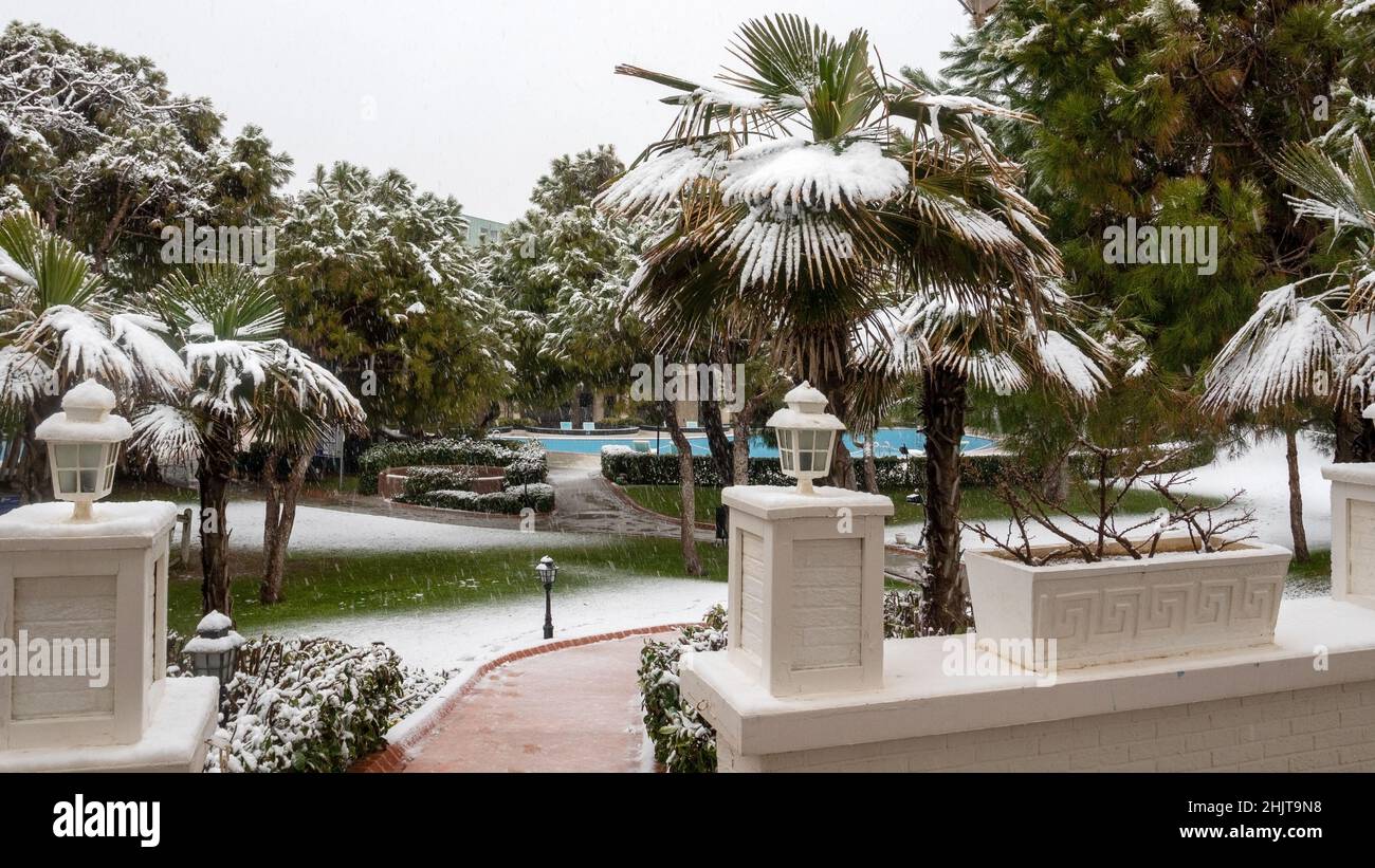 Heavy snowfall on the Mediterranean coast. Snow storm and white covered ...