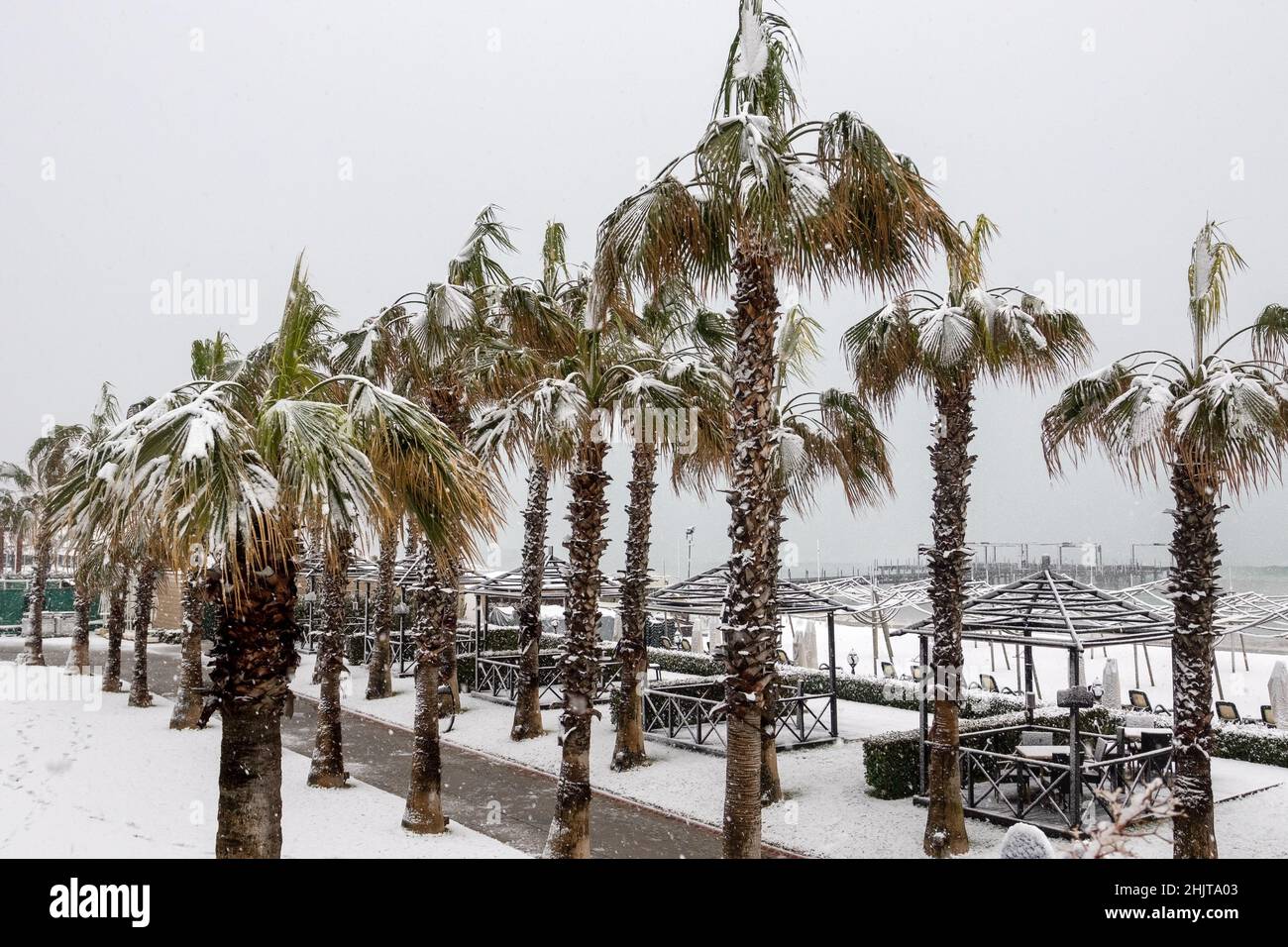 Heavy snowfall on the Mediterranean coast. Snow storm and white covered ...