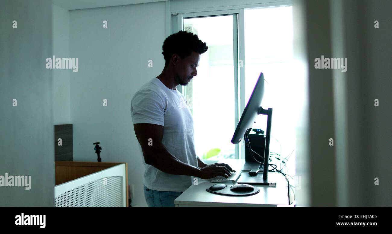 Person working from home with standing desk, black african american ...