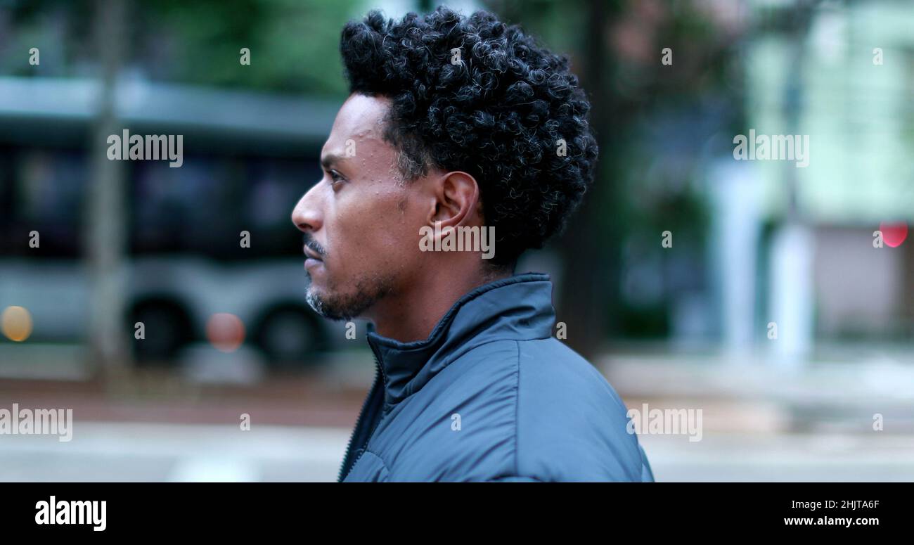 Side of black man walking in city, african american person moving ...