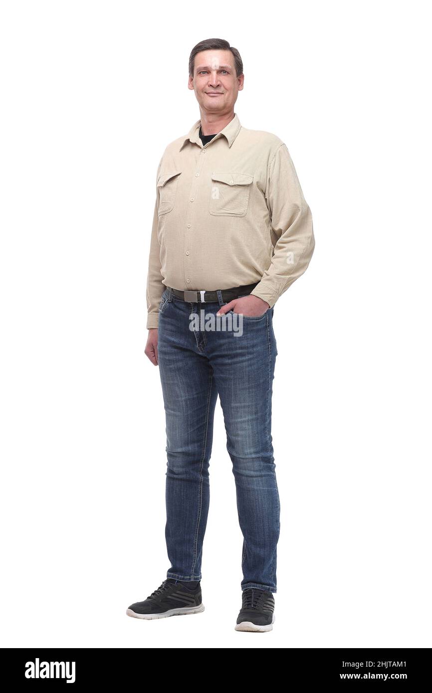 Full length portrait of a casual young man with hands in his pockets ...