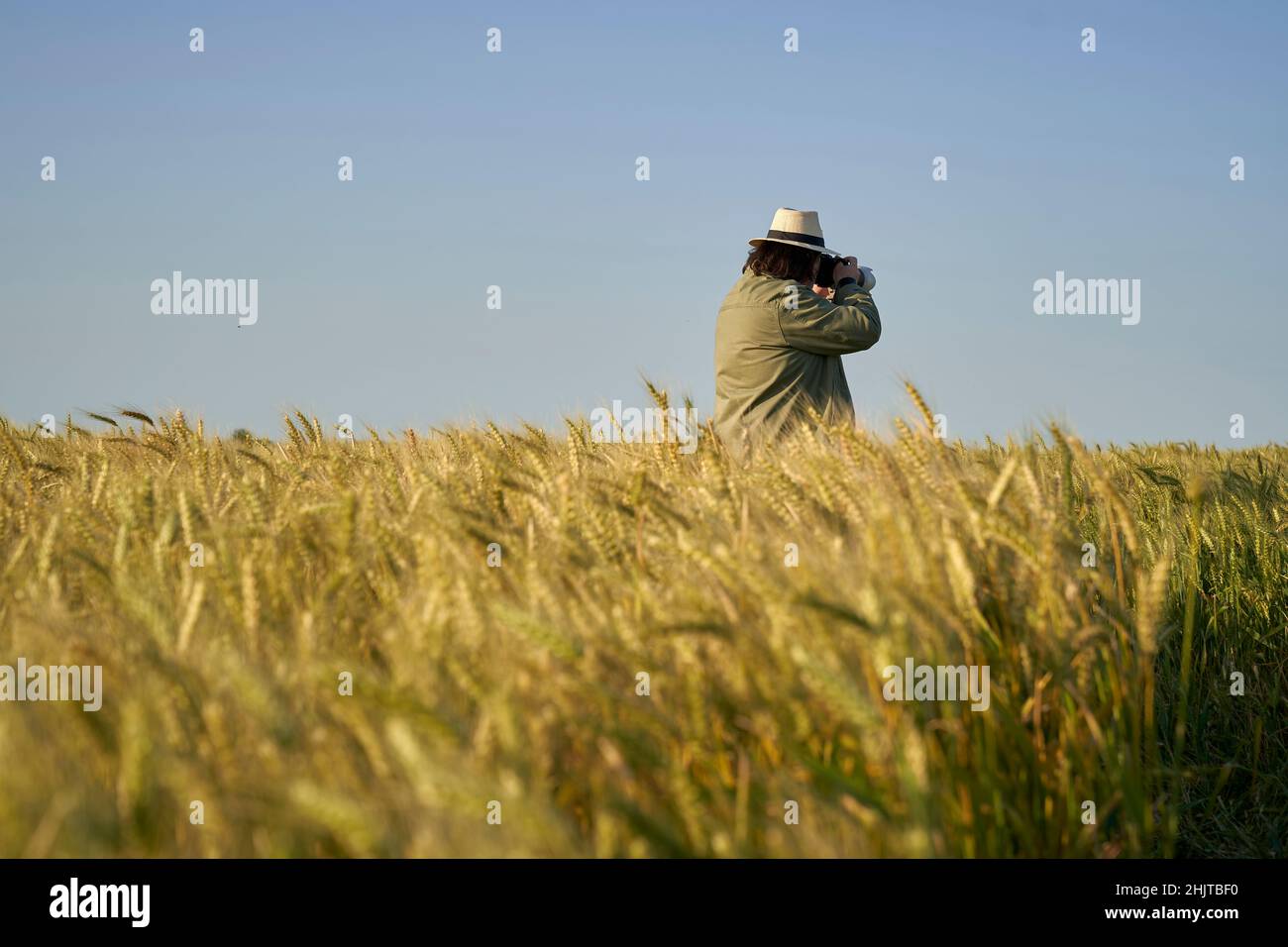 Back View Of Young Man Taking Photos Stock Photo - Alamy