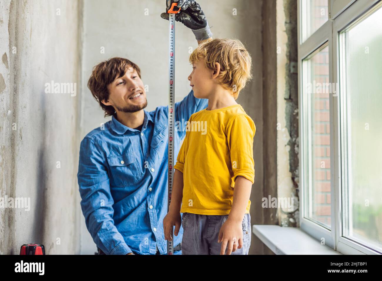 Father and son repair windows together. Repair the house yourself Stock ...