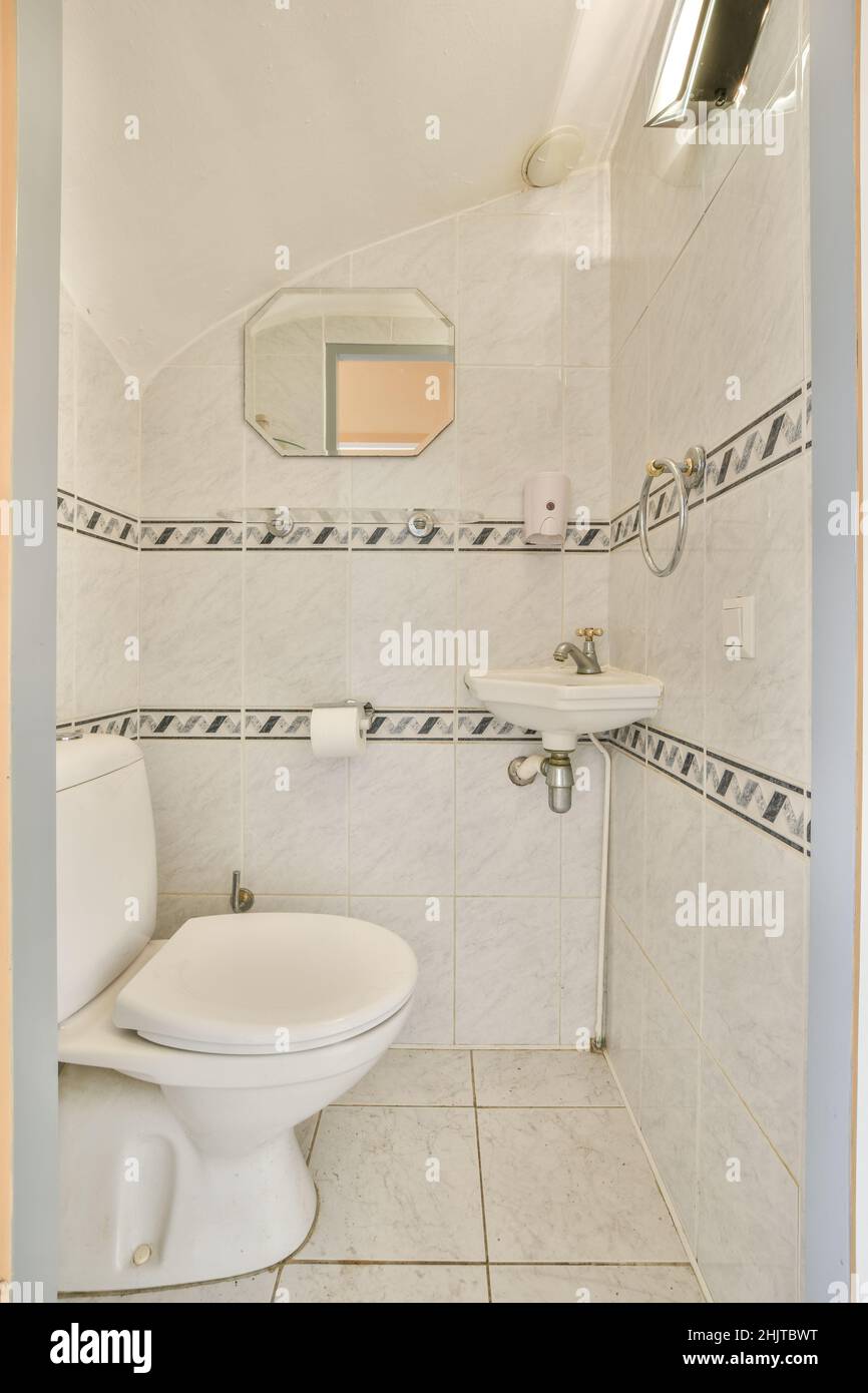 Interior of small clean restroom in miniature style Stock Photo - Alamy