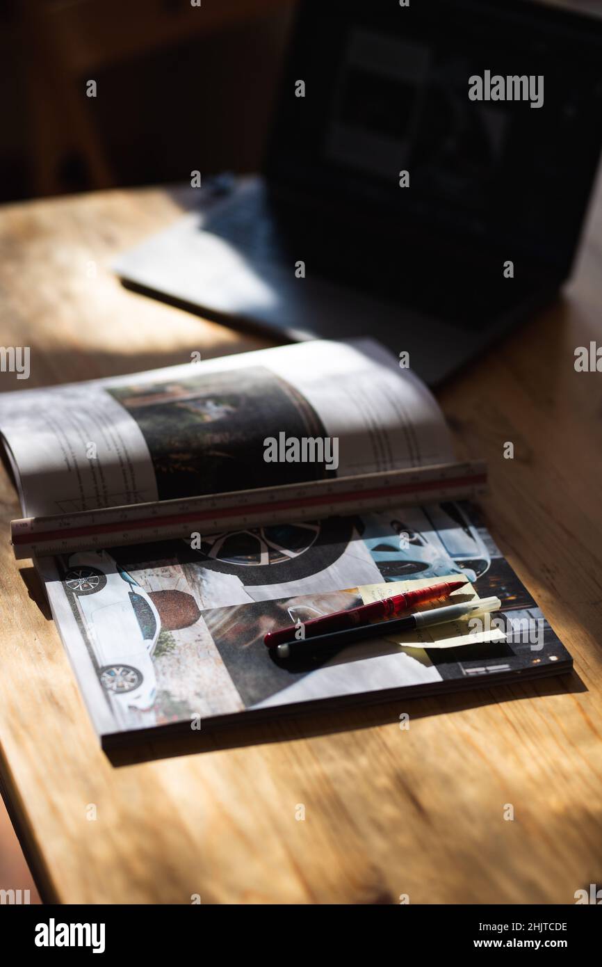 Working on a magazine Stock Photo - Alamy