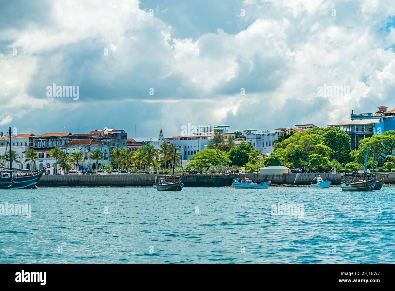 STONE TOWN, ZANZIBAR - DECEMBER 22, 2021: Boats in a port of Stone Town ...