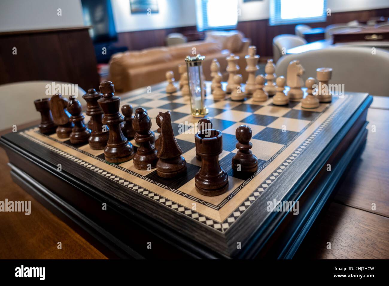 Angled view of a beautiful, wood chess board, with light and dark wood ...