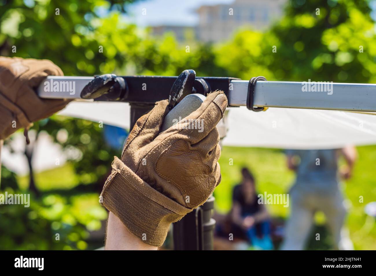 Grip team, light depurtment members prepare the lighting equipment ...