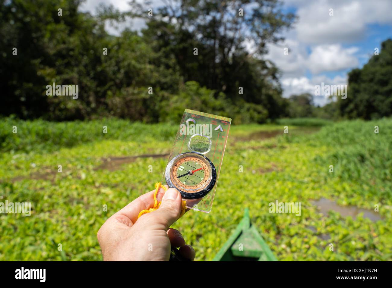orientation with the compass in a canoe trip on the Gamboa river . At ...