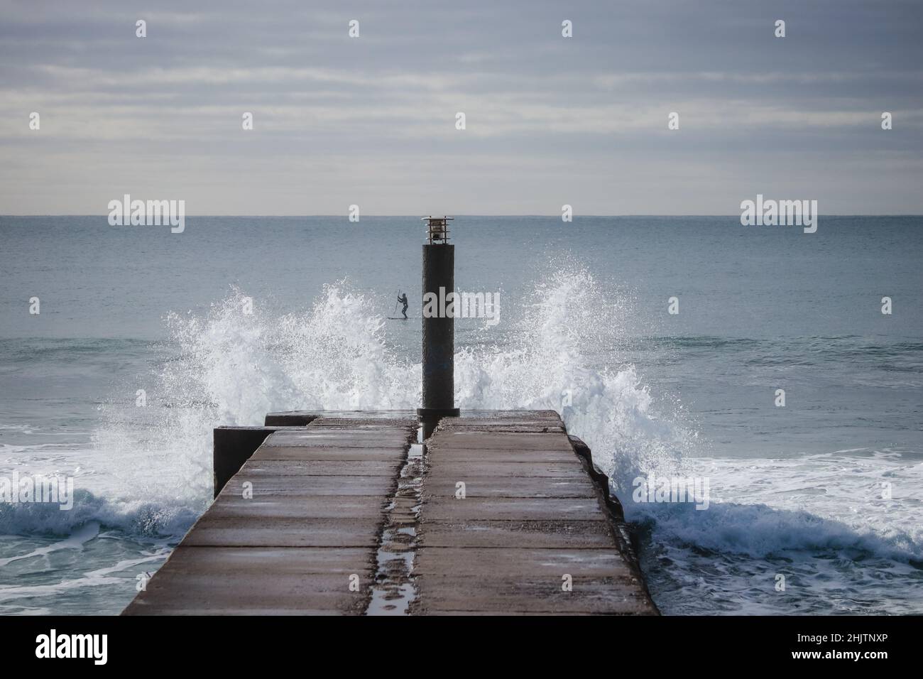 big ocean wave hit in a jetty in a stormy day Stock Photo - Alamy