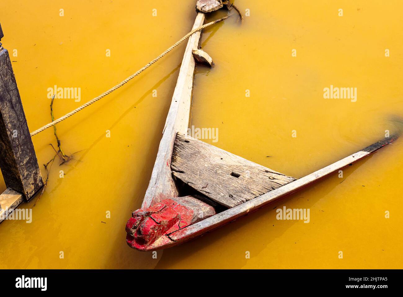 Sunken wood row boat in the polluted river after a storm hit Stock ...