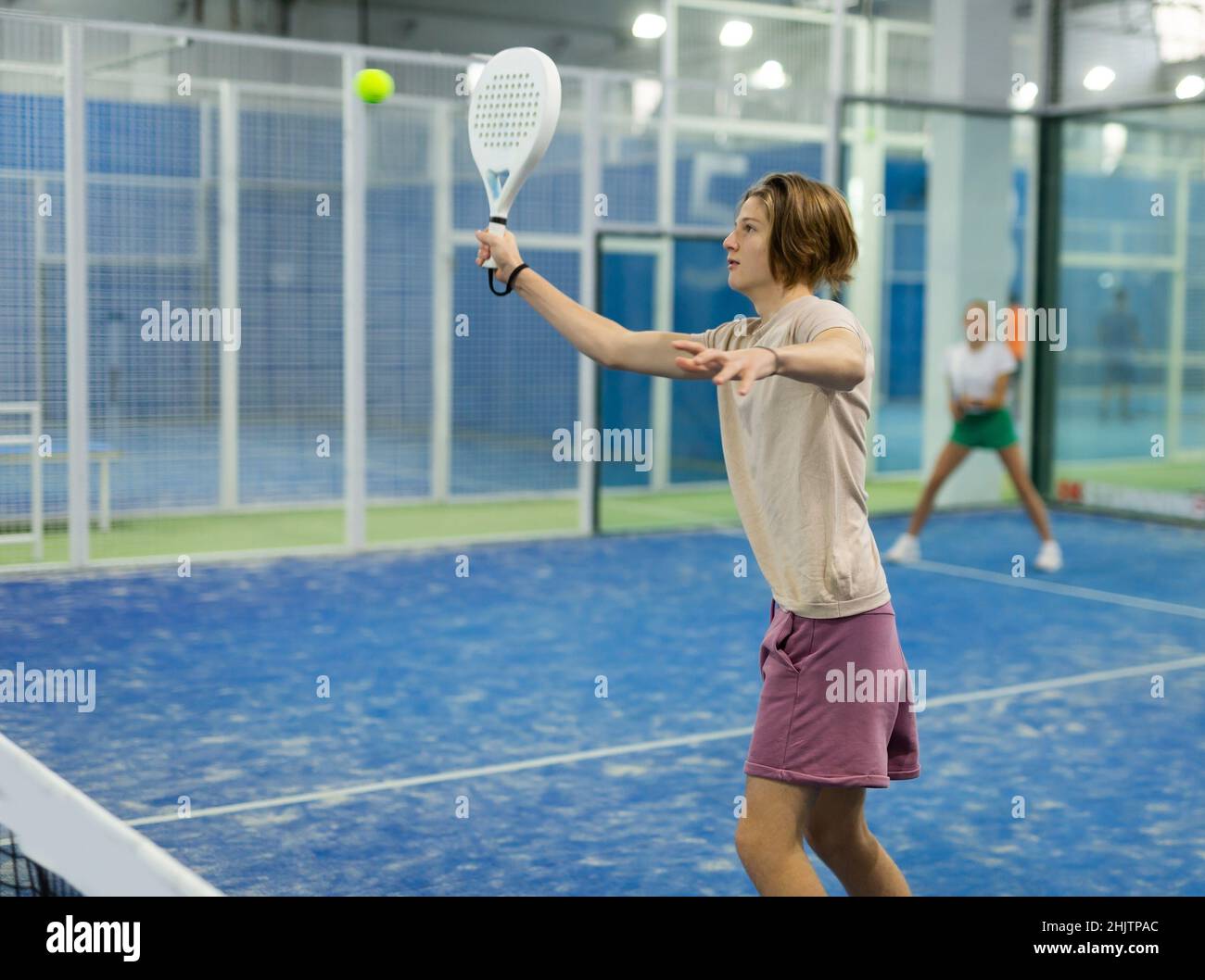 Portrait of a guy tennis player playing padel Stock Photo - Alamy