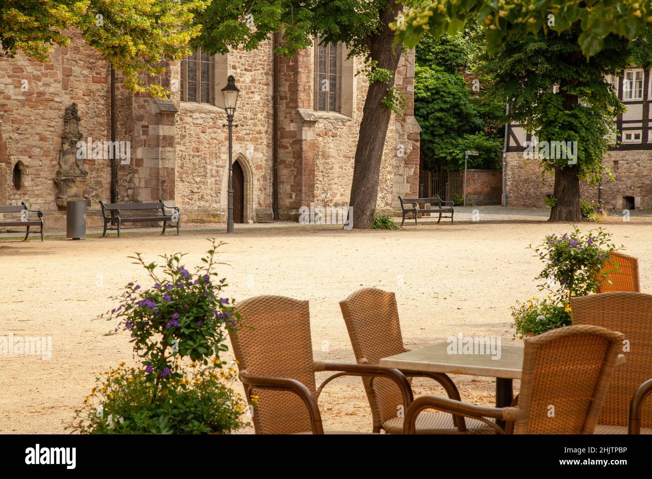 Outdoor Courtyard with Seating Area and Church Wall, Germany Stock ...