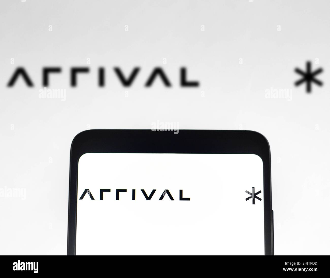 In this photo illustration the Arrival logo seen displayed on a ...
