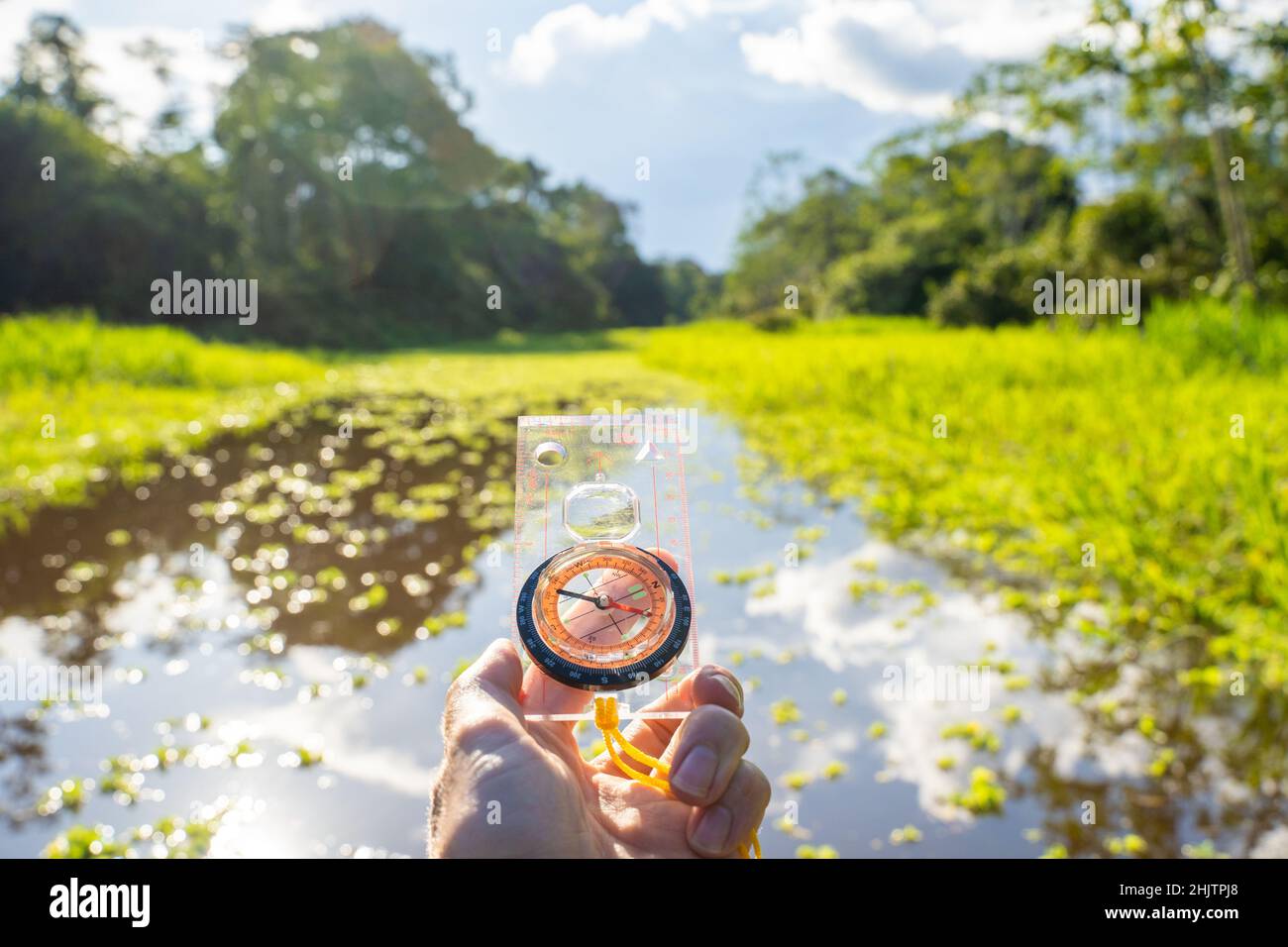 orientation with the compass in a canoe trip on the Gamboa river . At ...