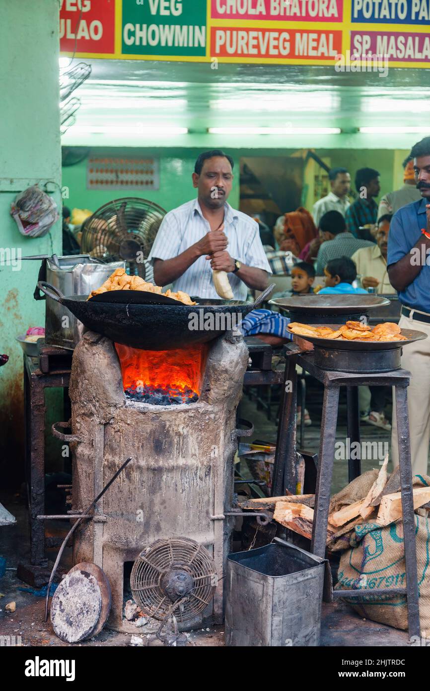 Urban lifestyle: street food, samosas cooking on the roadside in ...