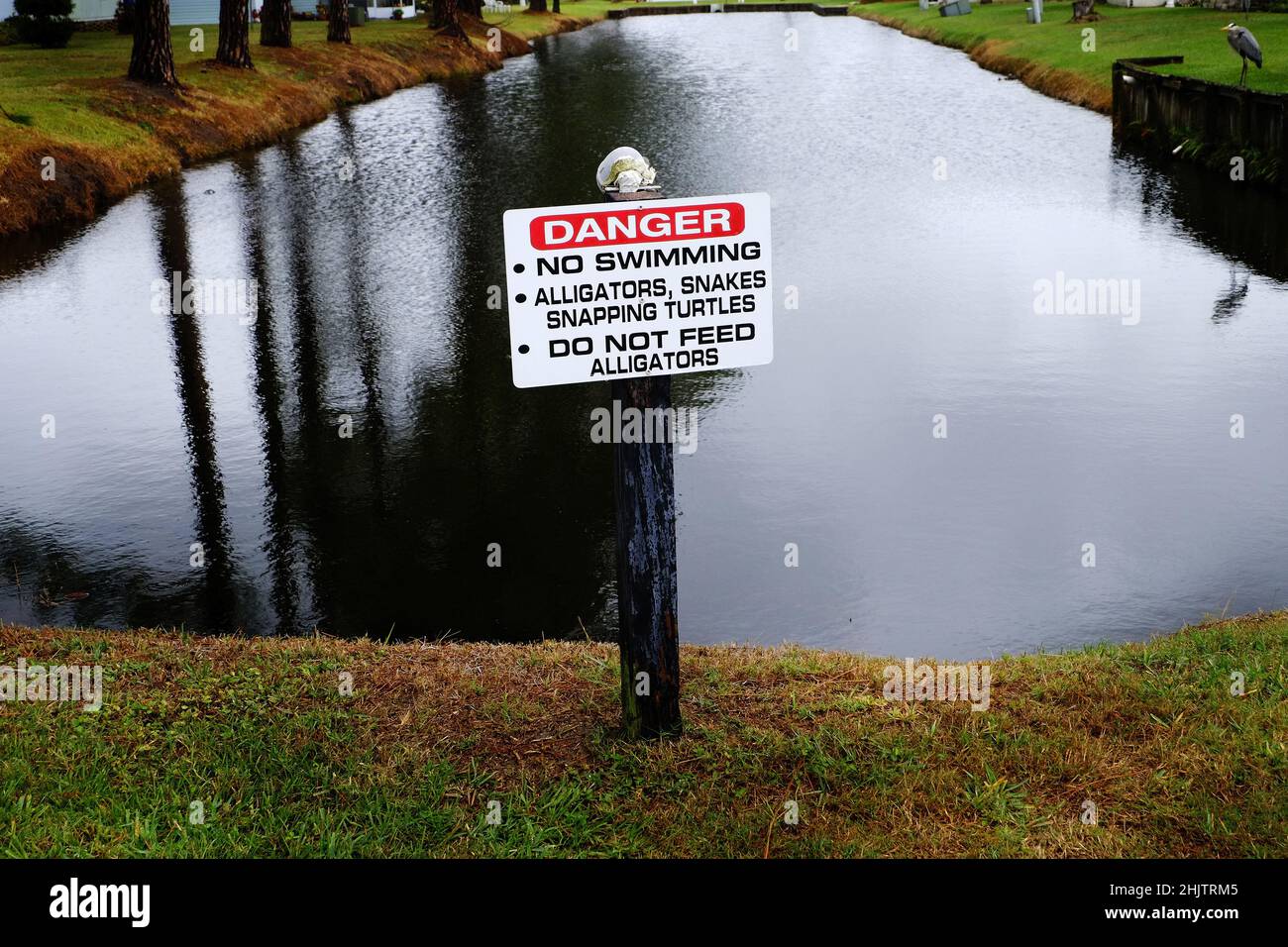 A warning sign near a canal in Florida in the United States Stock Photo ...