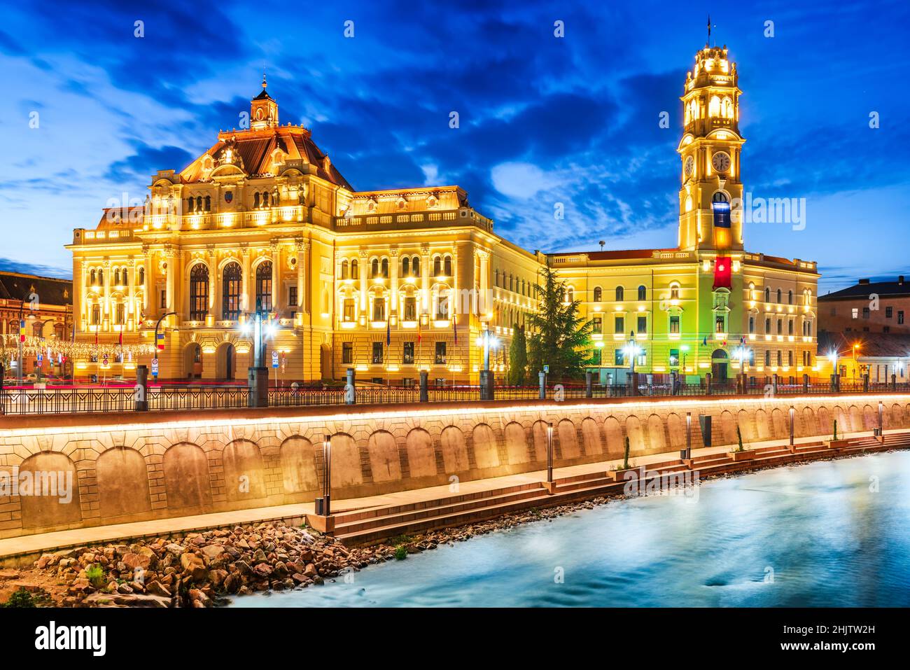 Oradea, Romania. Beautiful twilight with Cris River and the City Hall ...