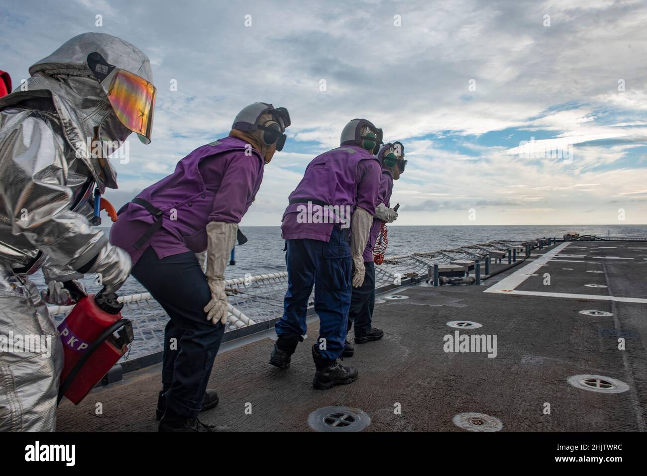 Crew members of the USCGC Stratton (WMSL 752) prepare to refuel a MH ...