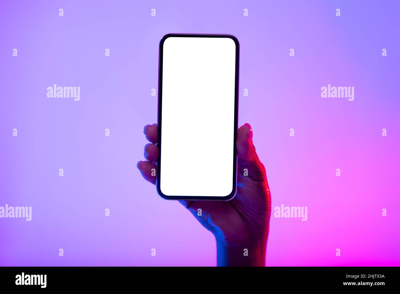 Cropped view of African American female showing cellphone with empty ...