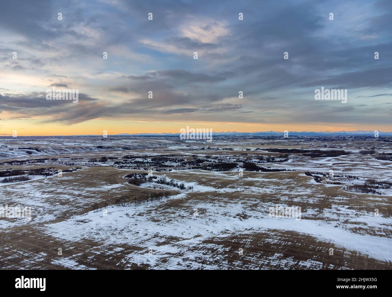 High aerial shot of the Alberta prairies during morning sunrise in ...