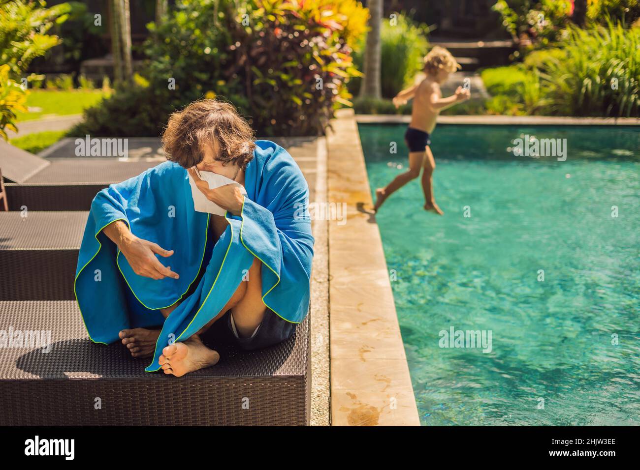 Sick man traveler. The man caught a cold on vacation, sits sad at the ...