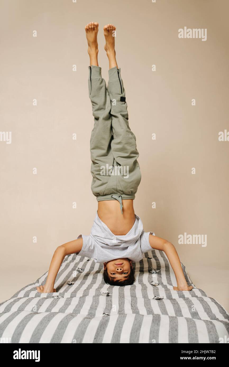 Headstand kid hi-res stock photography and images - Alamy