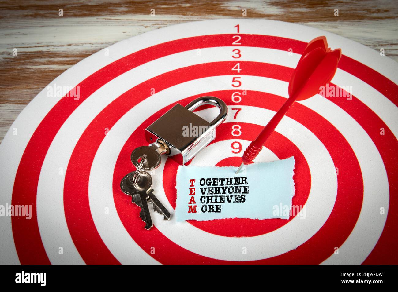 TEAM. Together everyone achieves more. Red target and dart Stock Photo ...