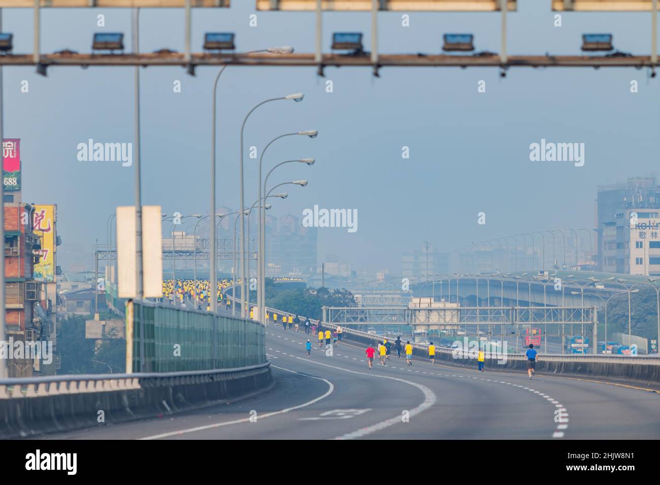 Taipei, MAR 17 2013 - Close up shot of people running in highway ...