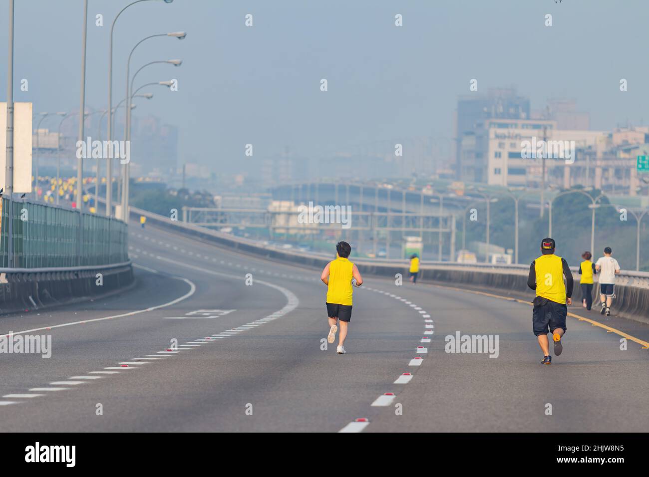 Taipei, MAR 17 2013 - Close up shot of people running in highway ...