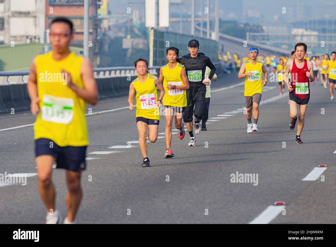 Taipei, MAR 17 2013 - Close up shot of people running in highway ...