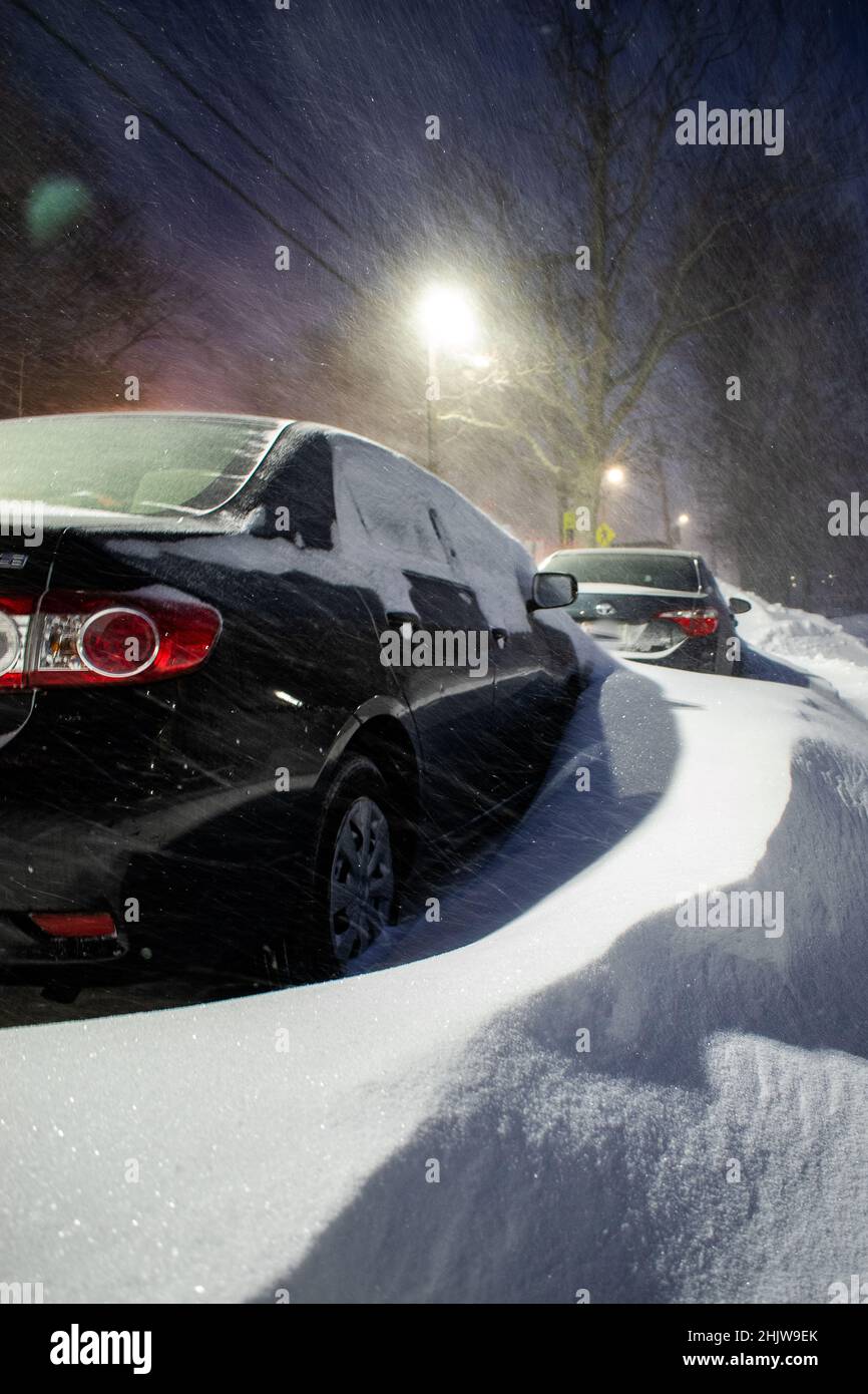 Cars snowed in during blizzard of 2022 Stock Photo - Alamy