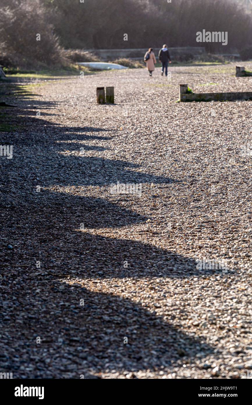 People walk on a beach by the North Sea in an East England well known ...
