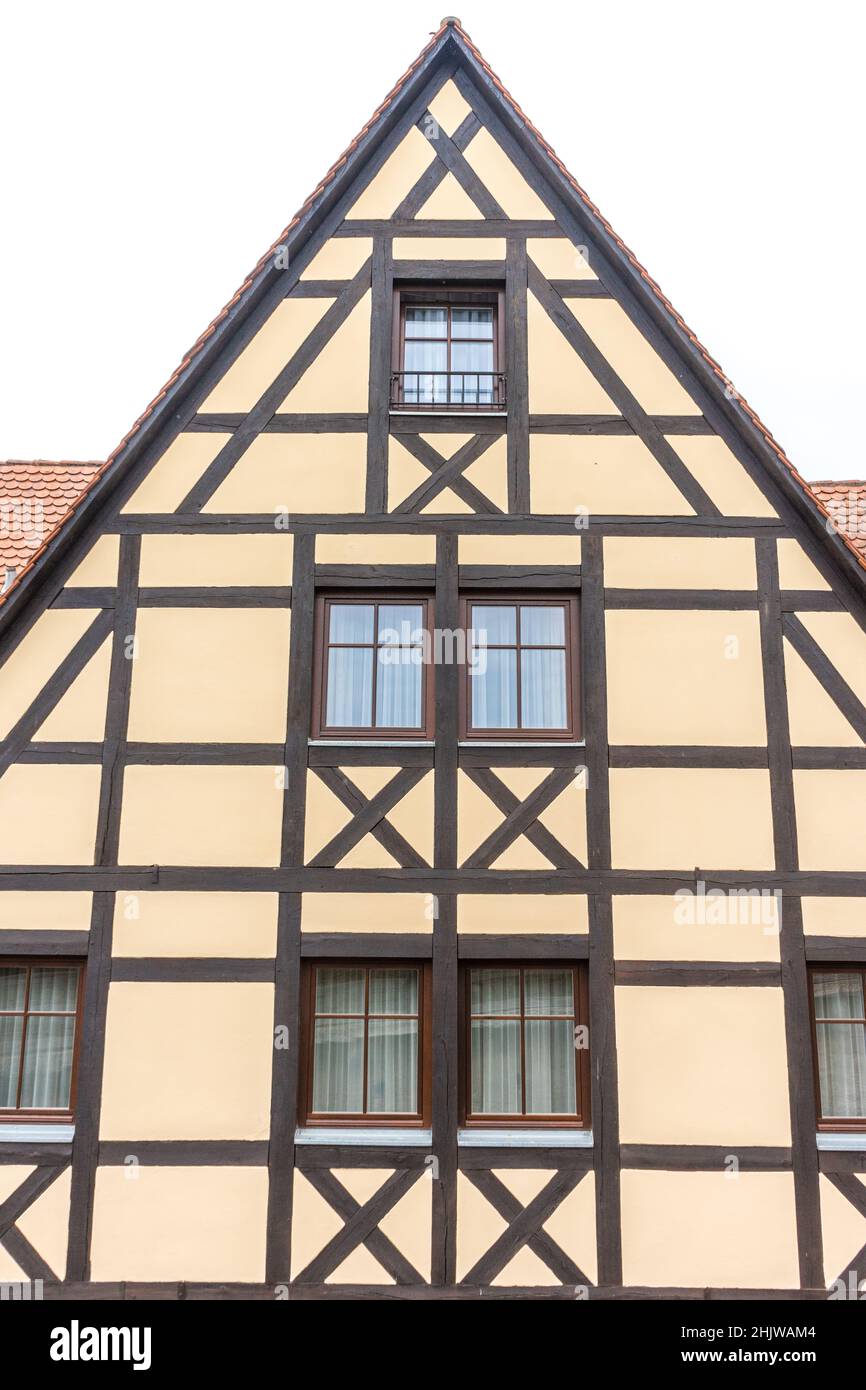 Vertical shot of a half-timber, Tudor-style home facade in Rothenburg ...