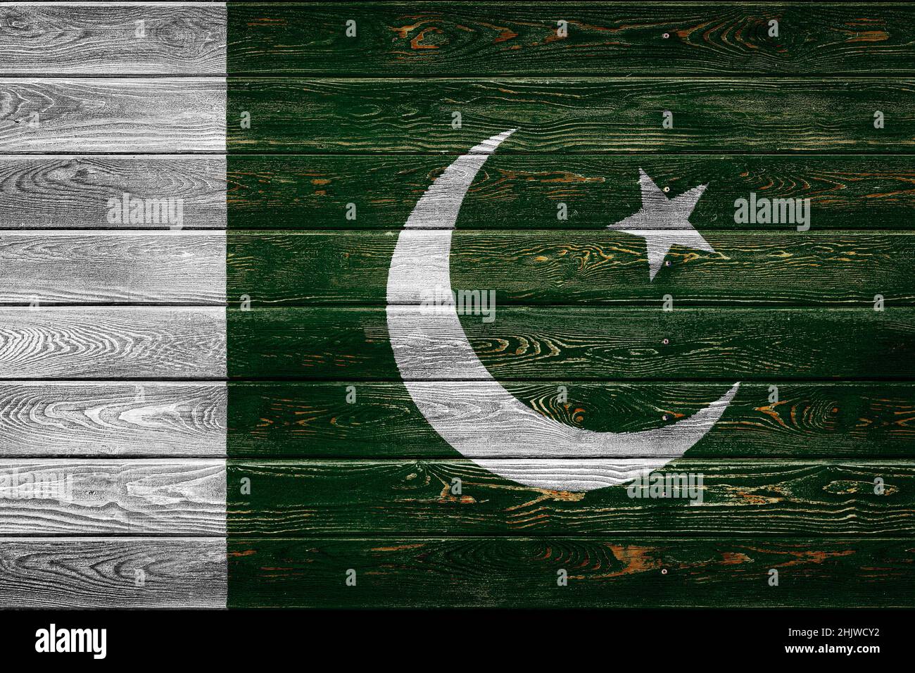 The national flag of Pakistan is painted on a camp of even boards ...