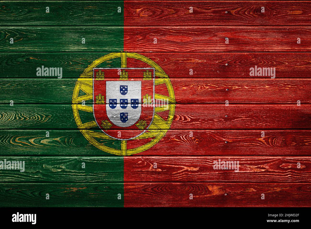 The national flag of Portugal is painted on a camp of even boards ...