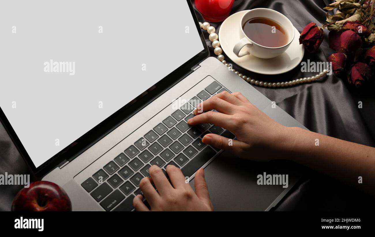 Top view, Female typing on laptop keyboard mockup on modern stylish ...