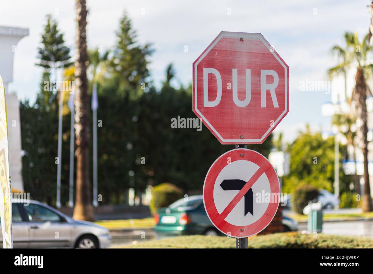 DUR and left turn prohibited road sign on a blue sky background Stock ...