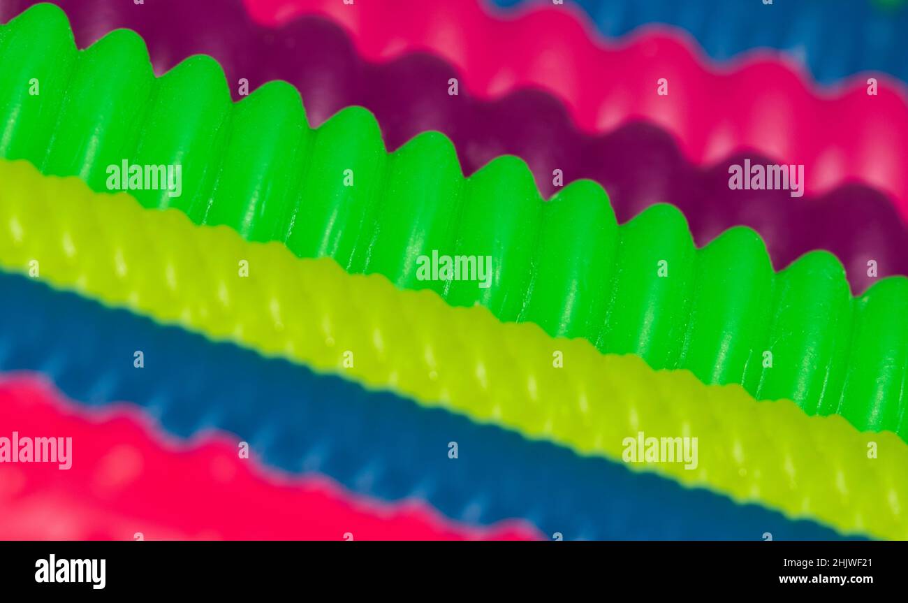 Colorful vibrant rubber cylinder shapes with different abstract ...