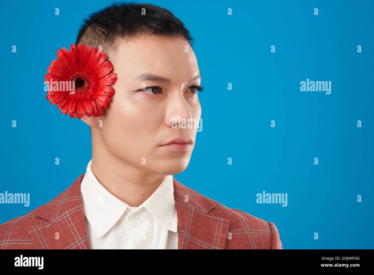 Man flower behind ear hi-res stock photography and images - Alamy