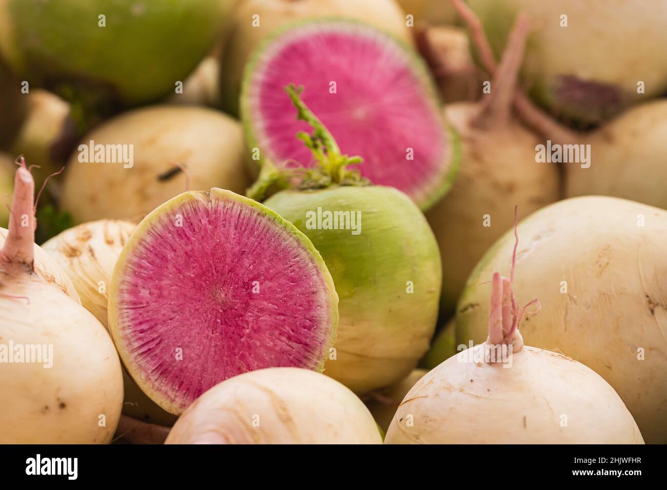 Watermelon red radish (Chinese daikon) on a shop window. View from ...