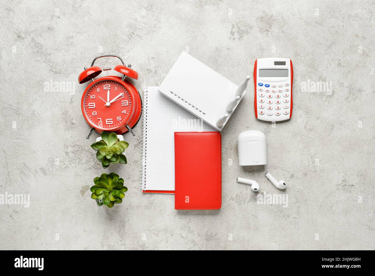 Wi-Fi router, alarm clock and stationery on grunge background Stock ...