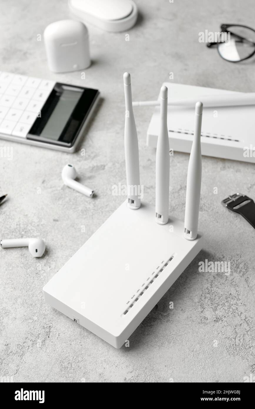 Wi-Fi router with antennas on grunge background Stock Photo - Alamy