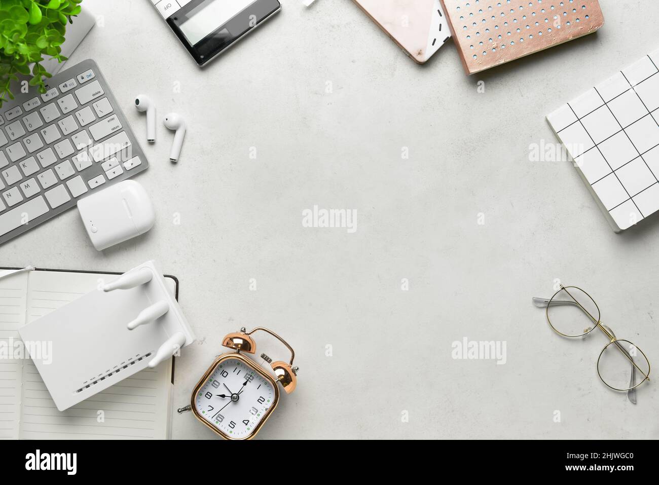 Wi-Fi router, keyboard and stationery on light background Stock Photo ...