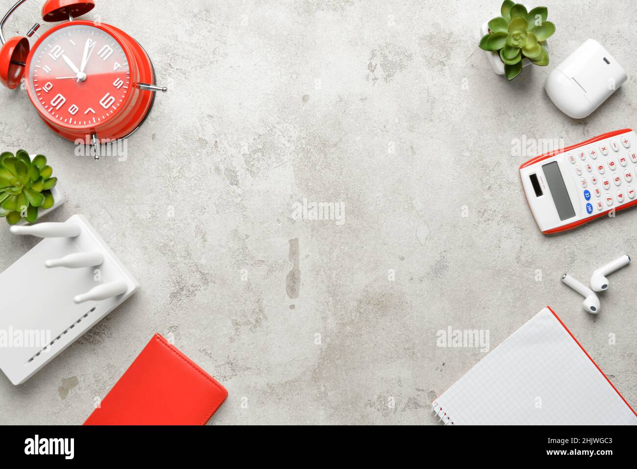 Wi-Fi router, alarm clock and stationery on grunge background Stock ...
