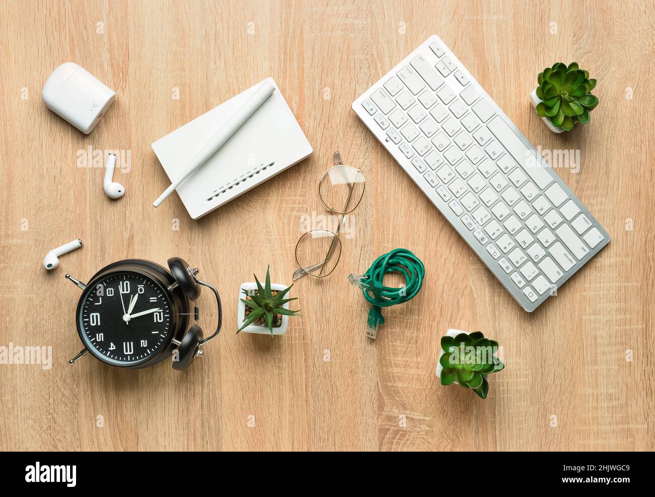 Different gadgets on wooden background Stock Photo - Alamy