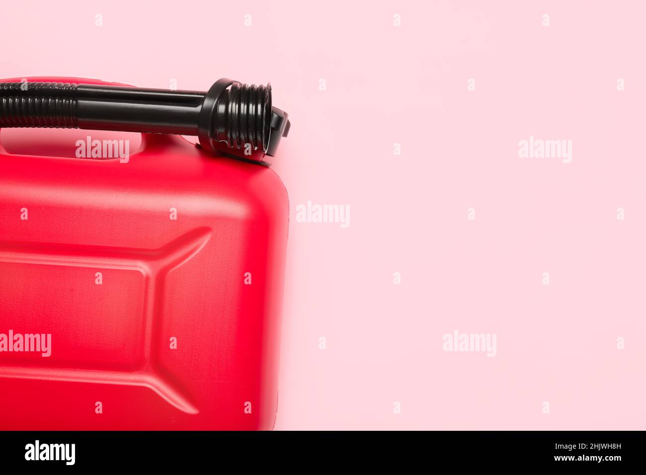 Plastic canister with rubber nozzle on color background Stock Photo - Alamy
